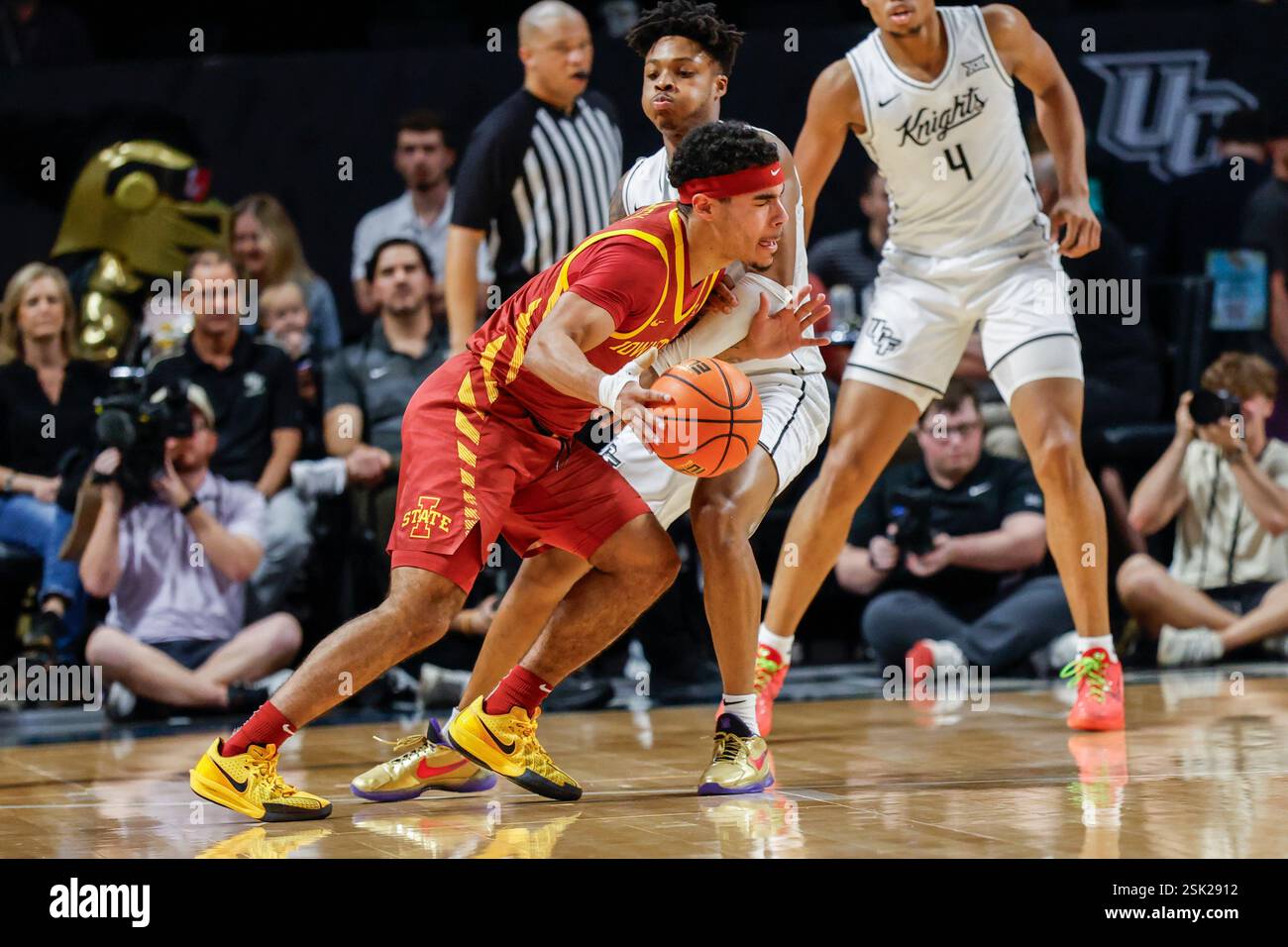 Iowa State guard Tamin Lipsey, left, is defend by UCF guard Jordan Ivy ...