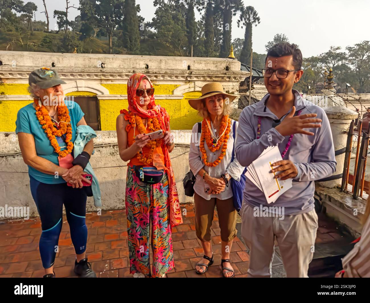 Our local guide expains the history of the Hindu Temple Comples of ...