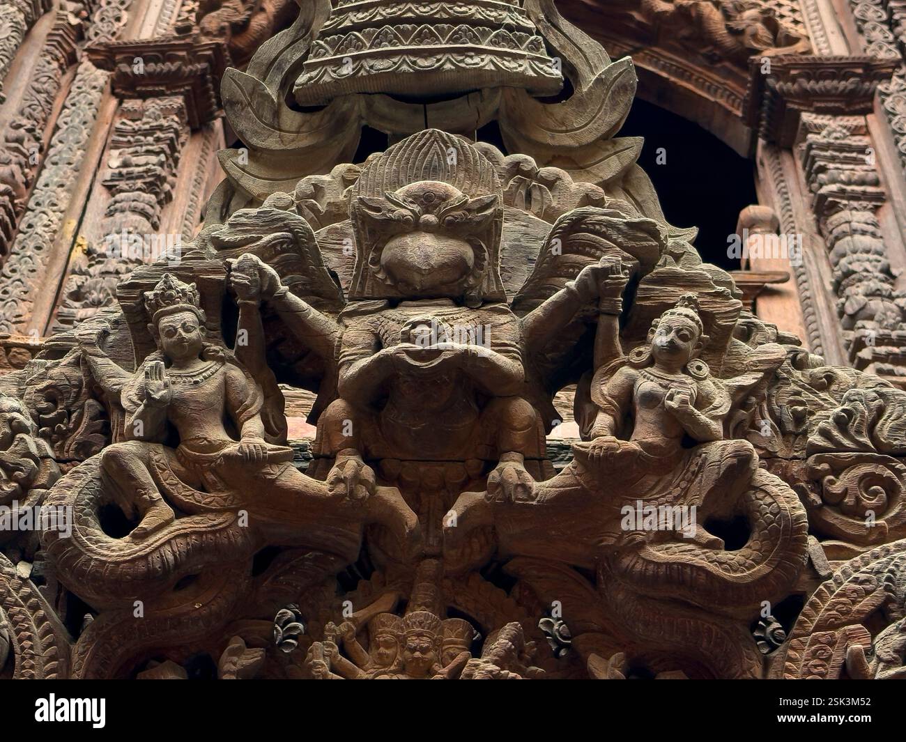 Carved wooden lintel of Garuda in the courtyard of Sundari Chowk of the ...