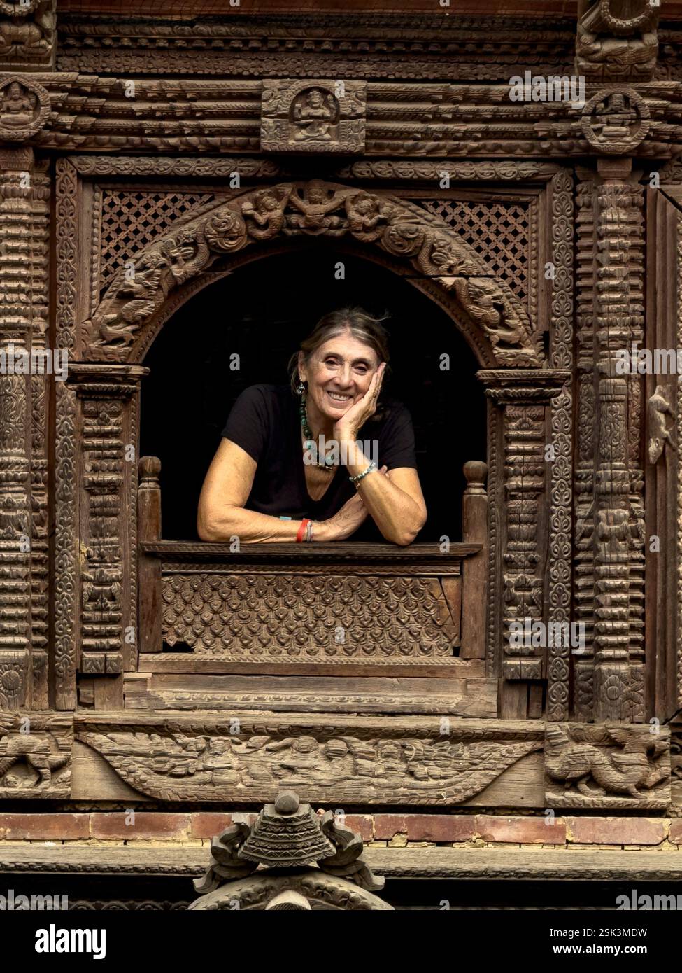 Christine Kolisch in an intricatly carved wooden window of the Sundari ...