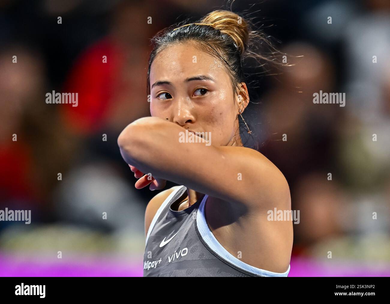 Doha, Qatar. 11th Feb, 2025. Zheng Qinwen of China reacts during women ...