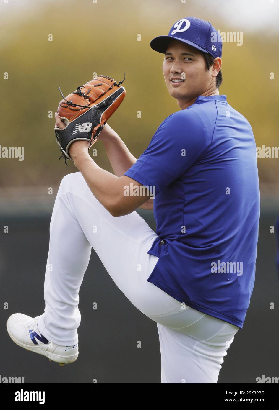 Shohei Ohtani of the Los Angeles Dodgers plays catch at the team's ...