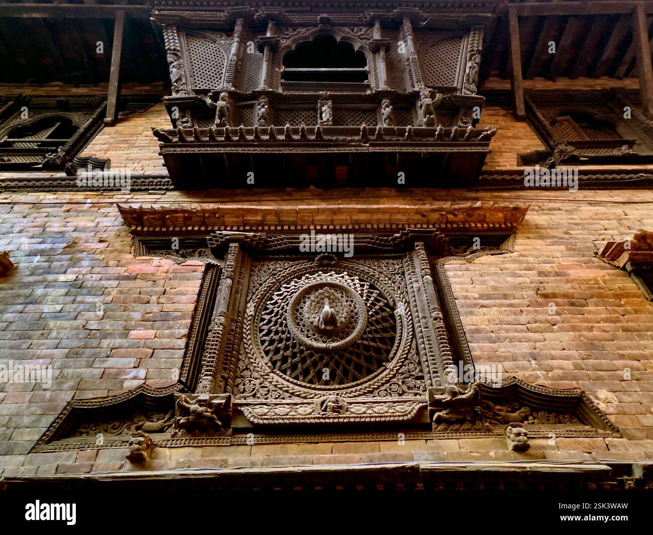 An intricatly carved peacock window inBhaktapur, a UNESCO World ...