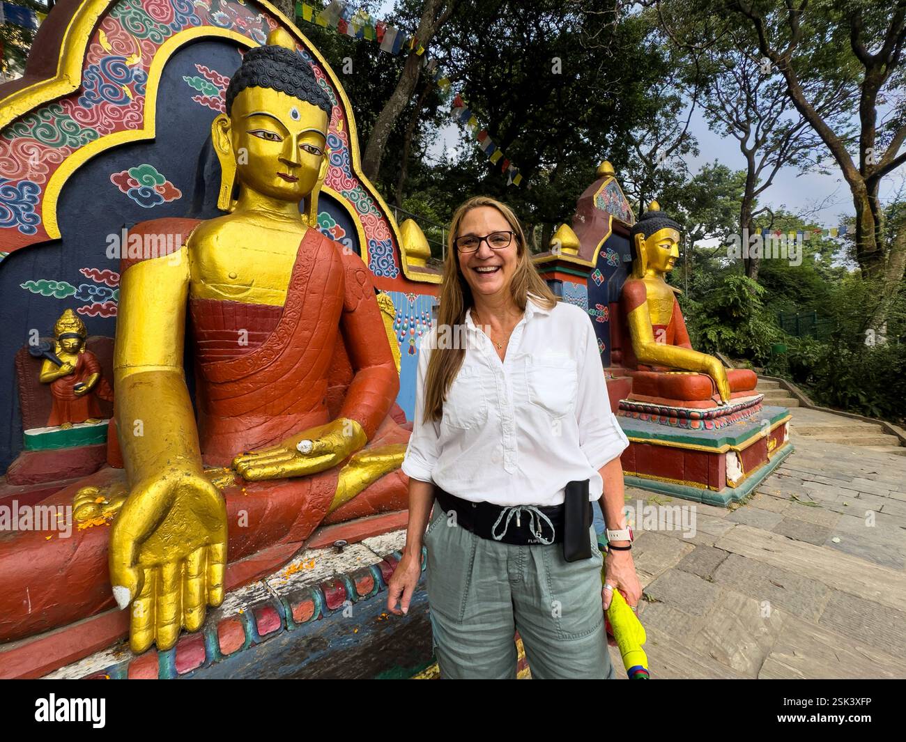 Kathy Hill with Sakyamuni Buddha staues on route to Swayambunath Stupa ...