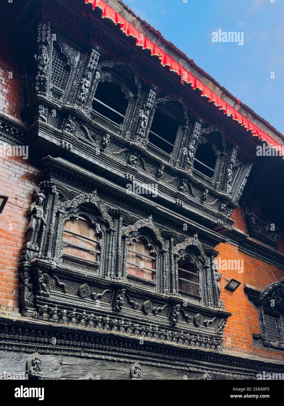 Carved wooden windows decorate the Hanuman Dhoka Royal Palace in Durbar ...