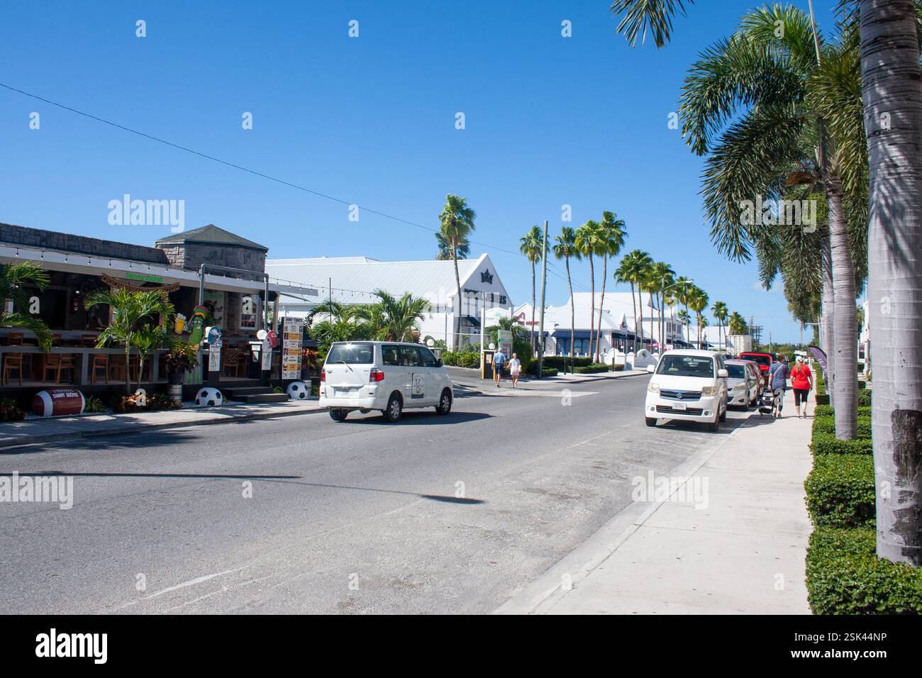 Shops and cars along Grace Bay road in Providenciales, Turks and Caicos ...