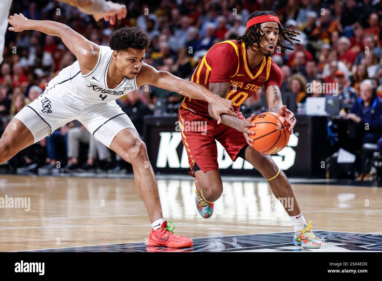 Central Florida guard Keyshawn Hall (4) tries to stop Iowa State guard ...