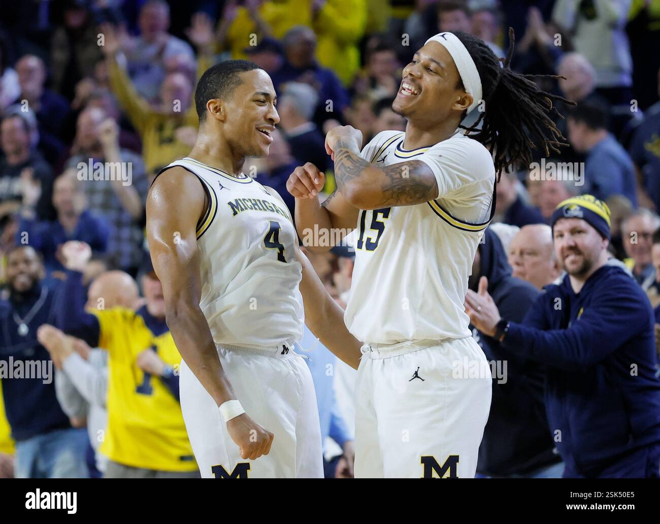 Michigan guard Rubin Jones (15) celebrates with guard Nimari Burnett (4 ...