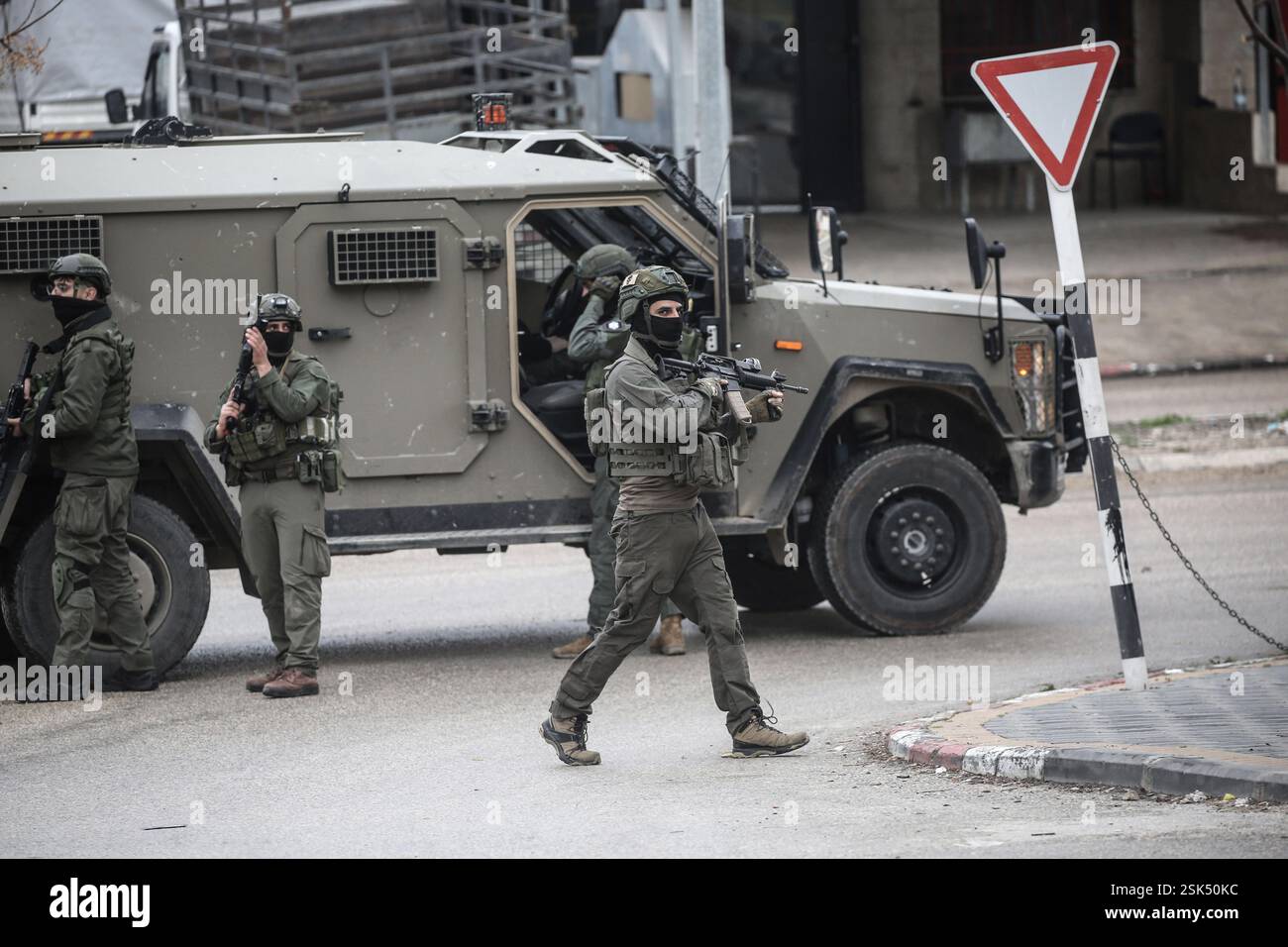 Israeli commandos take positions during a military operation in the Masaken al-Sha'biya ...