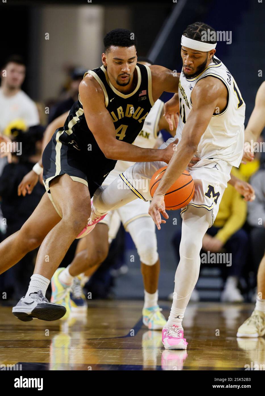 Purdue forward Trey Kaufman-Renn, left, and Michigan guard Roddy Gayle ...