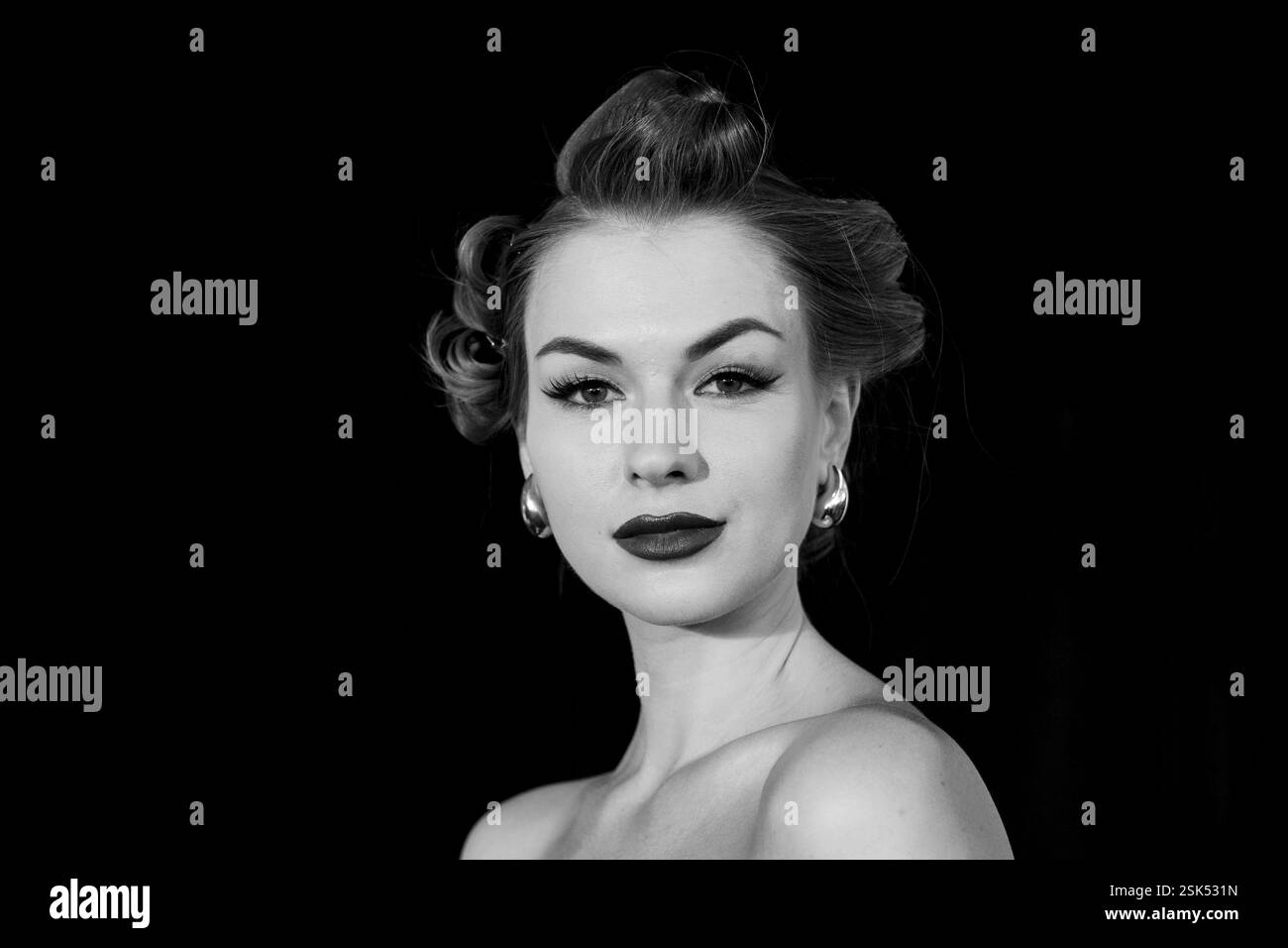 A model prepares backstage for runway for Pamella Roland runway show ...