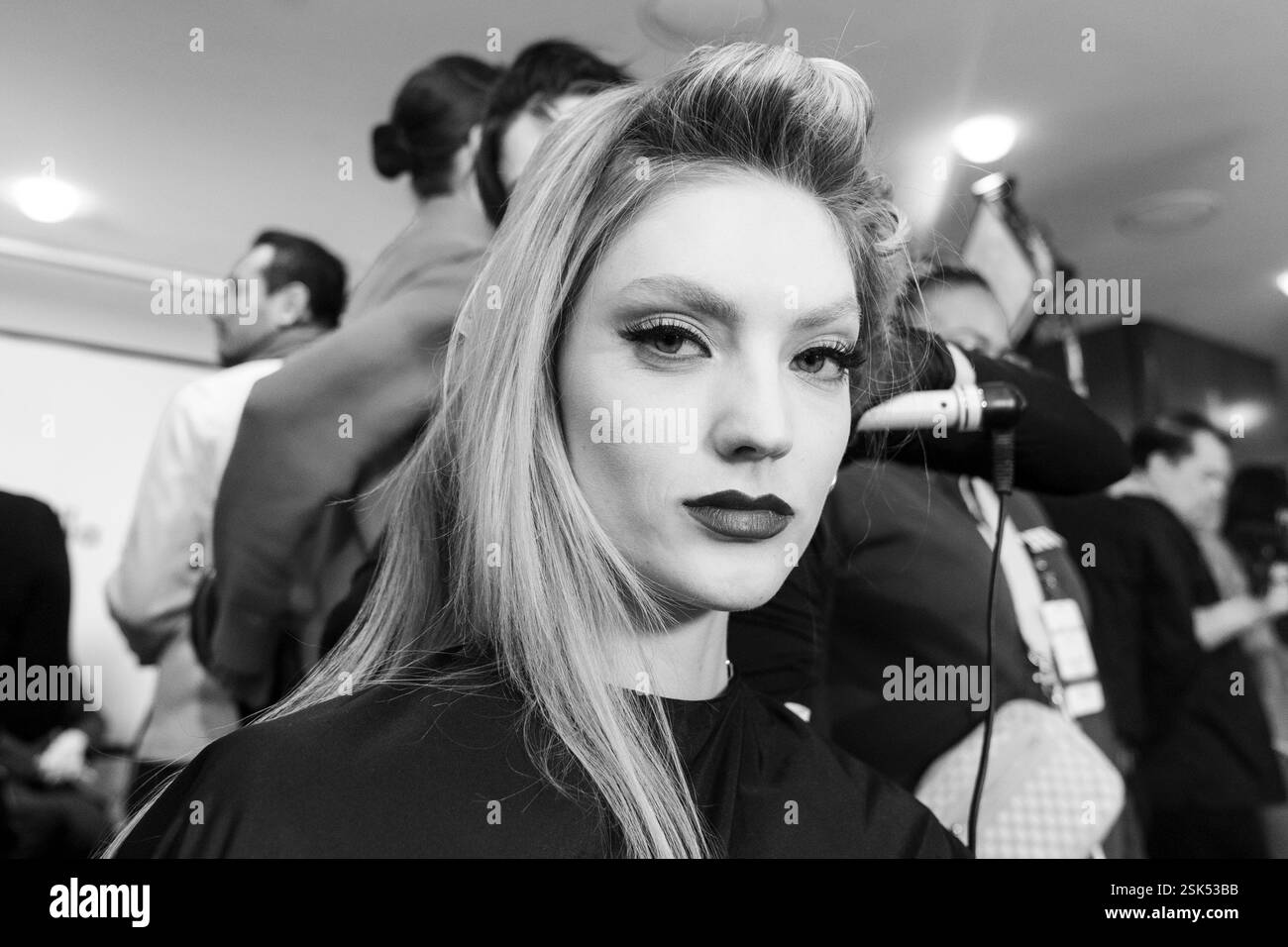 A model prepares backstage for runway for Pamella Roland runway show ...