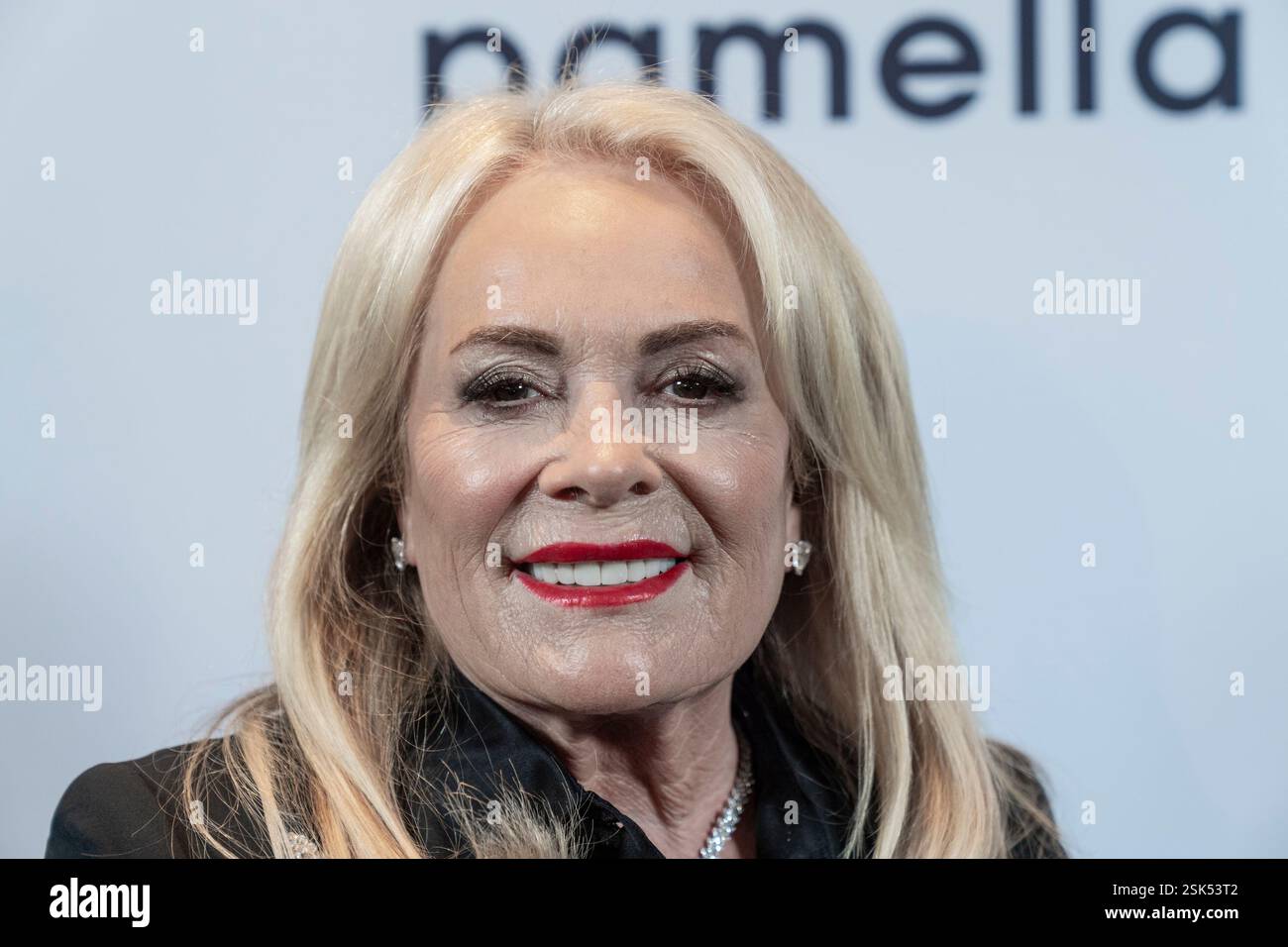 Designer Pamella Roland poses backstage for runway for Pamella Roland ...