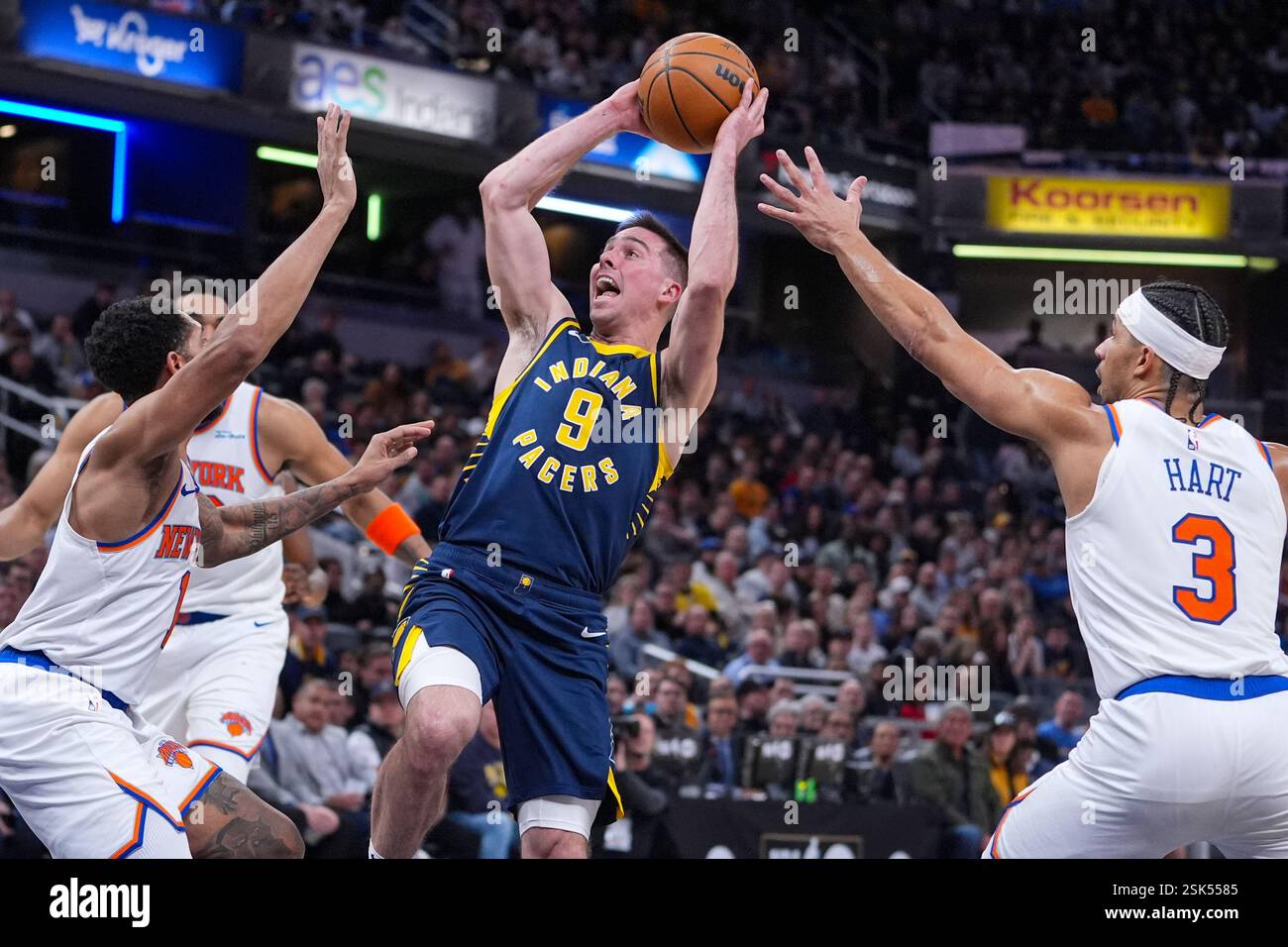 Indiana Pacers guard T.J. McConnell (9) shoots between New York Knicks ...
