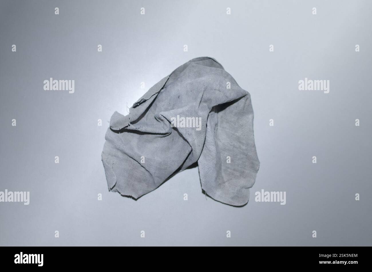 Crumpled Gray Cloth with human face silhouette on a Neutral Gray ...