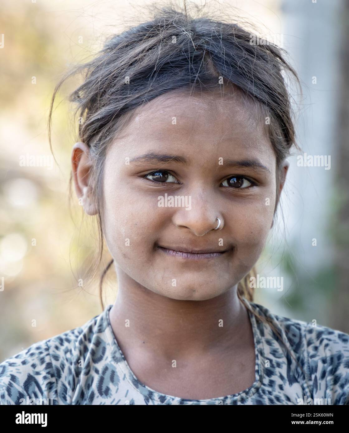 young poor garbage collecting girl with cute smiling facial expression ...