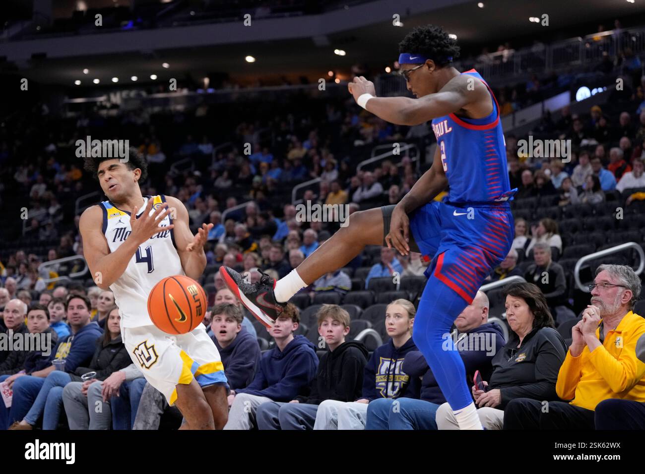 DePaul's Layden Blocker throws the ball off Marquette's Stevie Mitchell ...