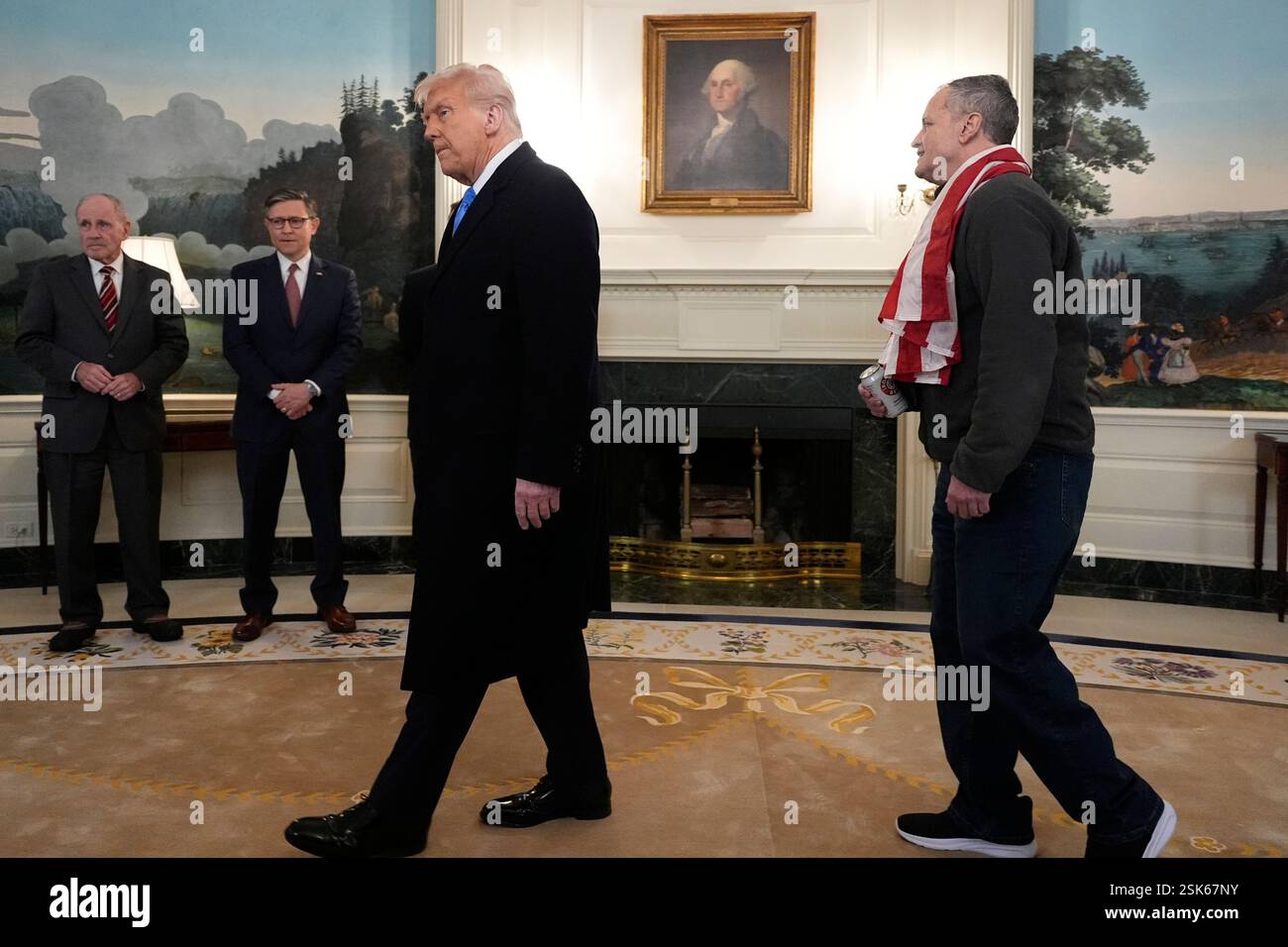 President Donald Trump, accompanied by Marc Fogel, walk in the ...