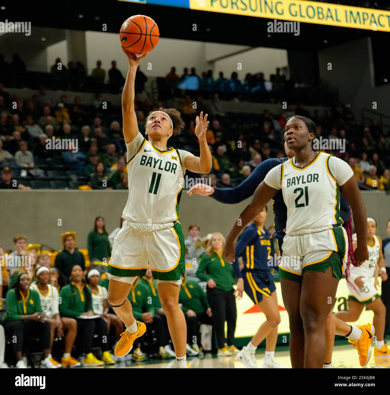 Waco, Texas, USA. 11th Feb, 2025. Baylor guard JADA WALKER (11) goes to ...