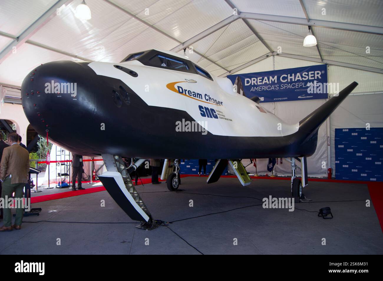 An engineering model of the Dream Chaser spaceplane on display at the ...