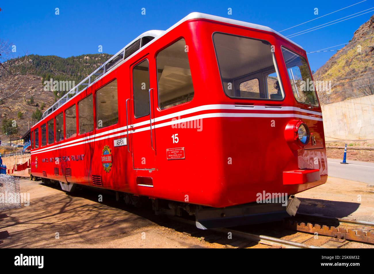 A bright red-painted rail car of the Manitou and Pike's Peak Railway at ...