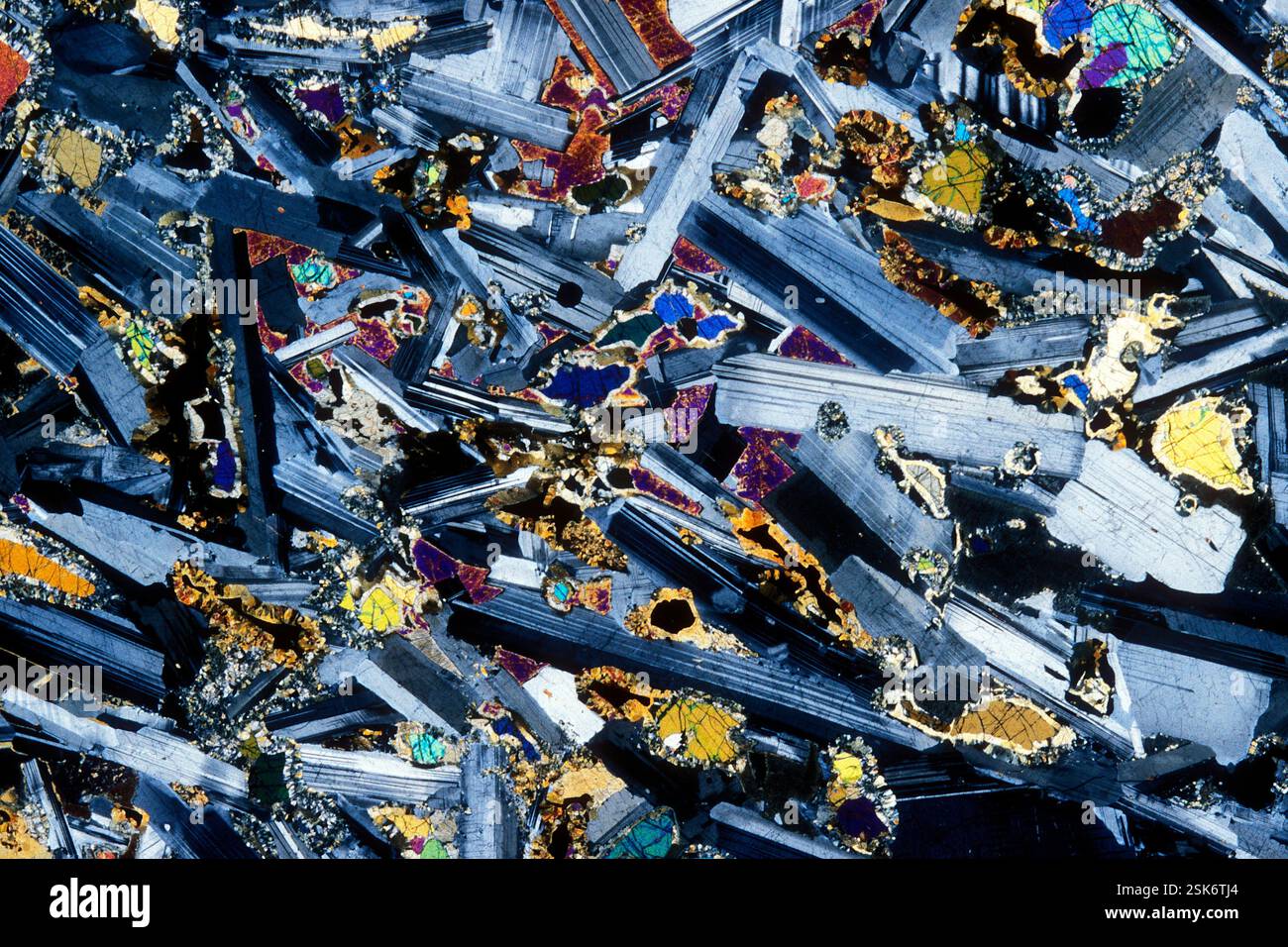 Dolerite rock crystals. Polarised light micrograph of a sample of ...