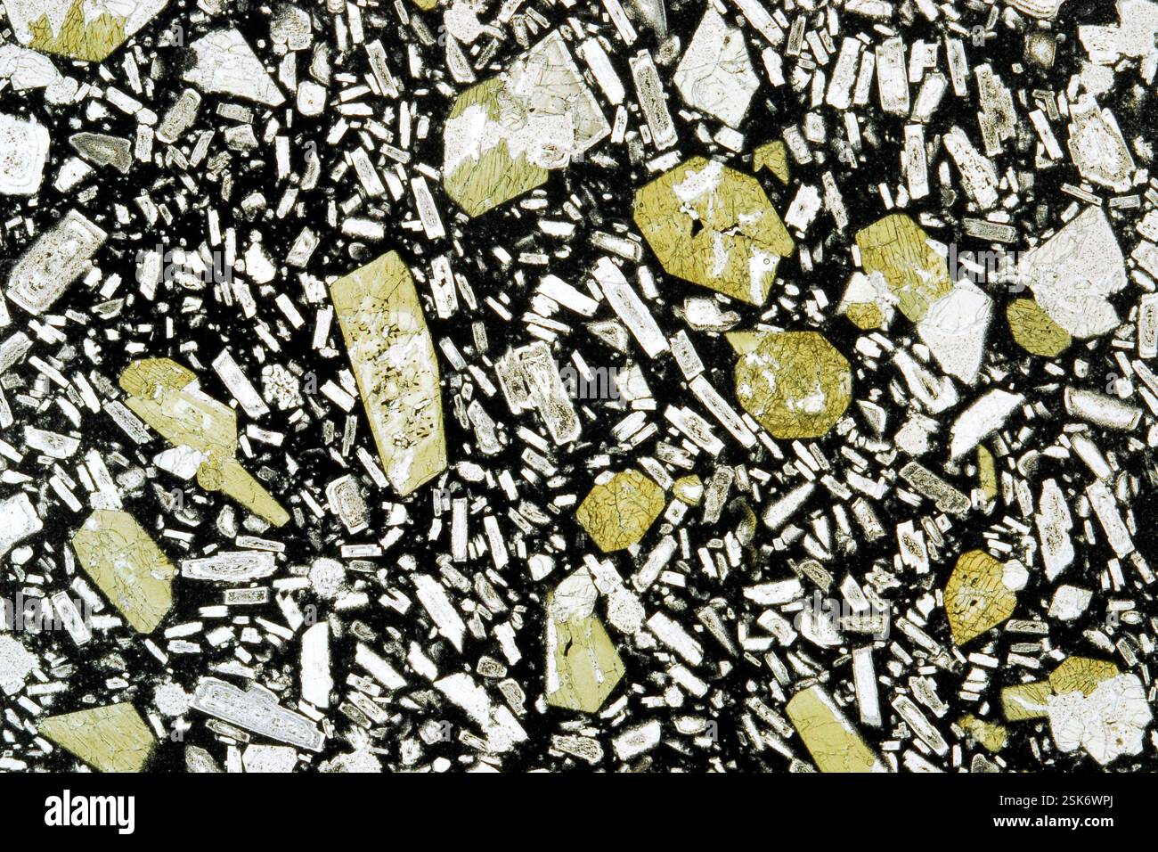 Basalt. Close-up of a thin section of basalt (black). Basalt is a ...
