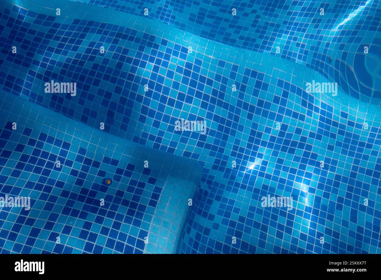 Water distorts bottom pool tiles Stock Photo - Alamy