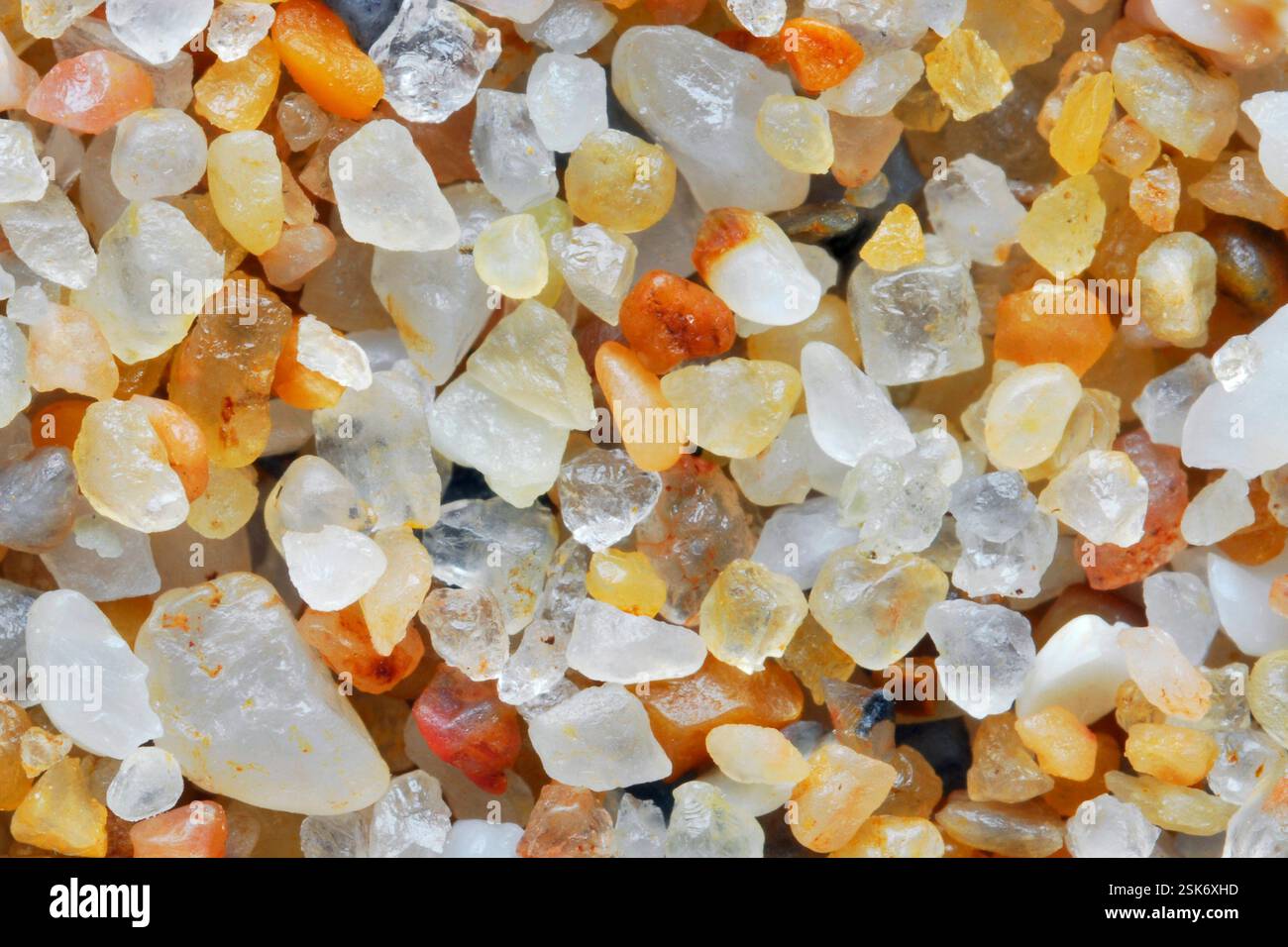 Quartz sand. Macro photograph of sand comprised mainly of broken pieces ...
