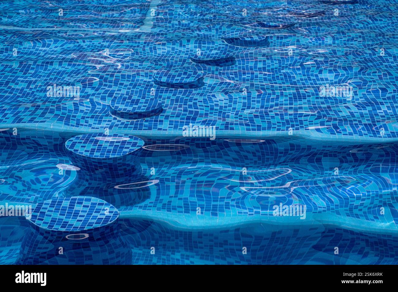 Water distorts bottom pool tiles Stock Photo - Alamy