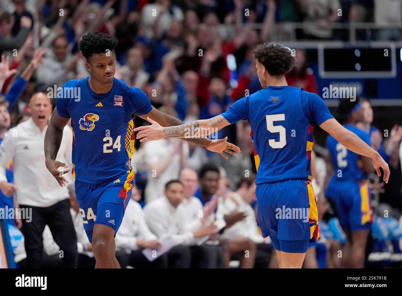 Kansas forward KJ Adams Jr. (24) and guard Zeke Mayo (5) celebrate ...