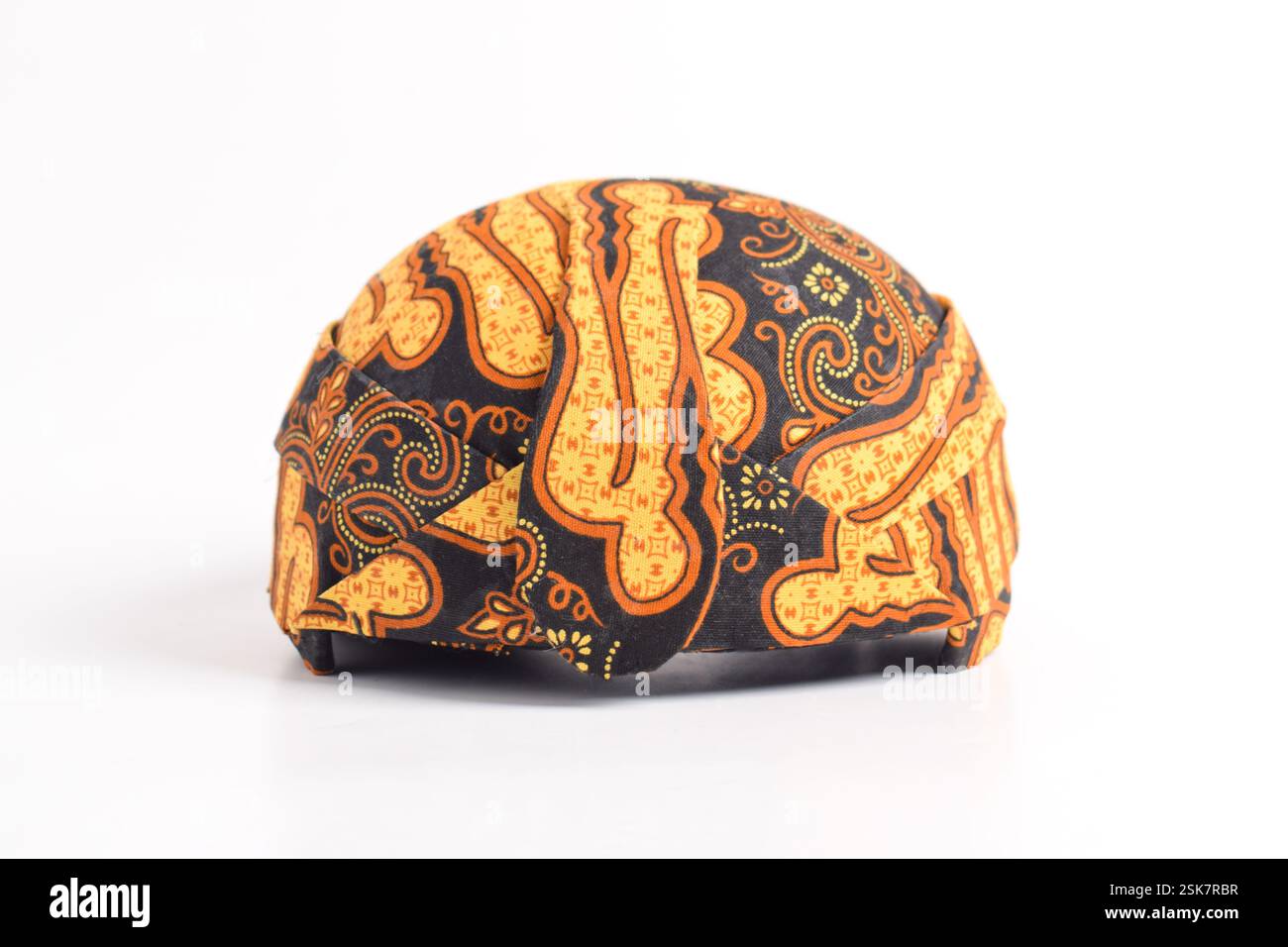 Blangkon, a traditional Javanese men's head covering made of batik ...