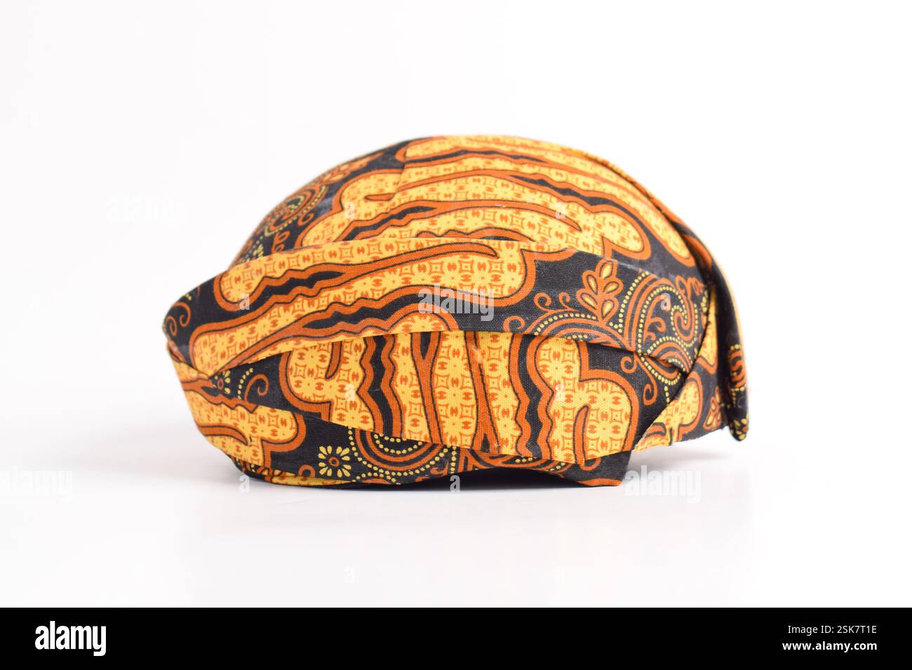 Blangkon, a traditional Javanese men's head covering made of batik ...