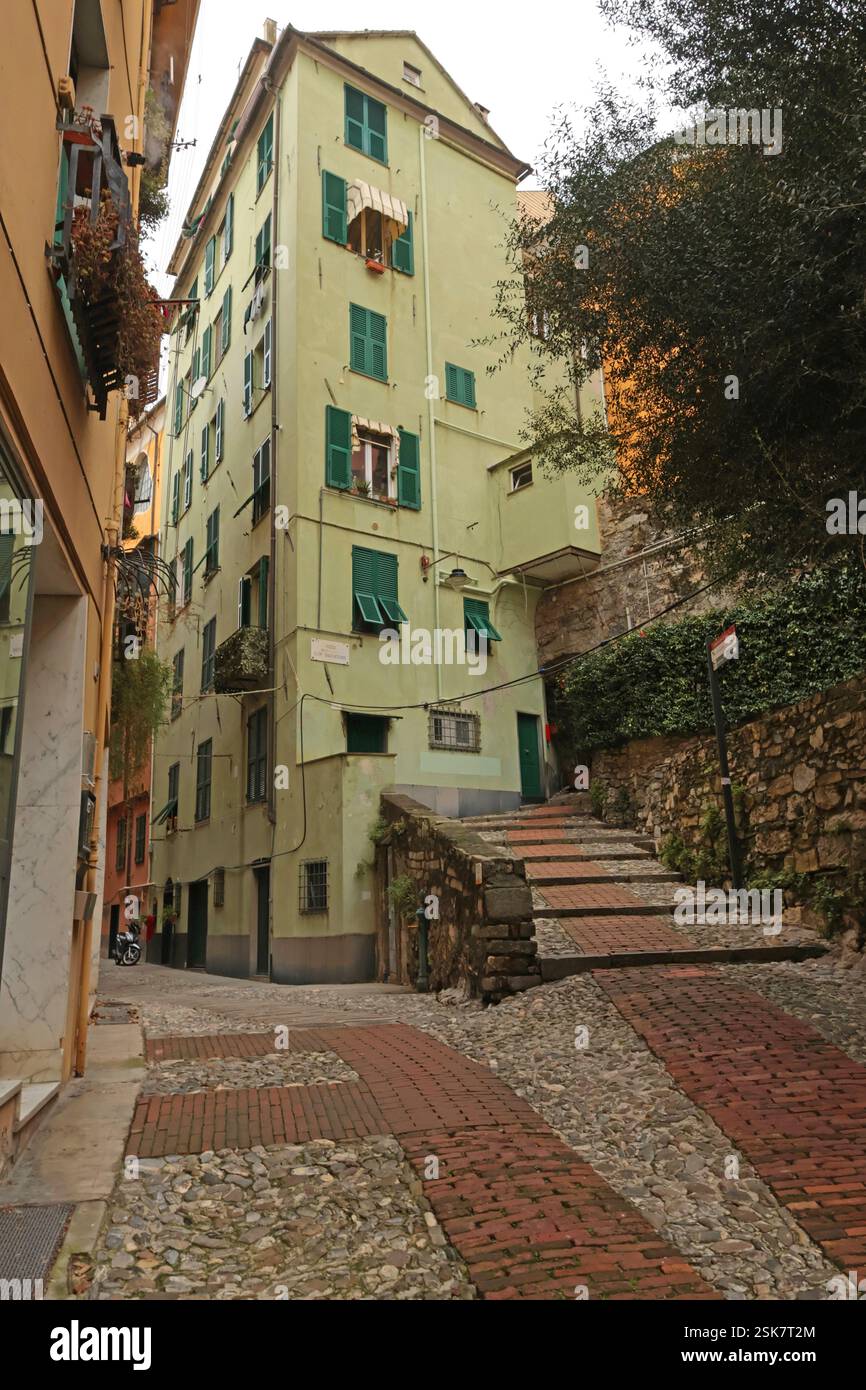 Old residential houses and narrow streets of city of Genoa ...