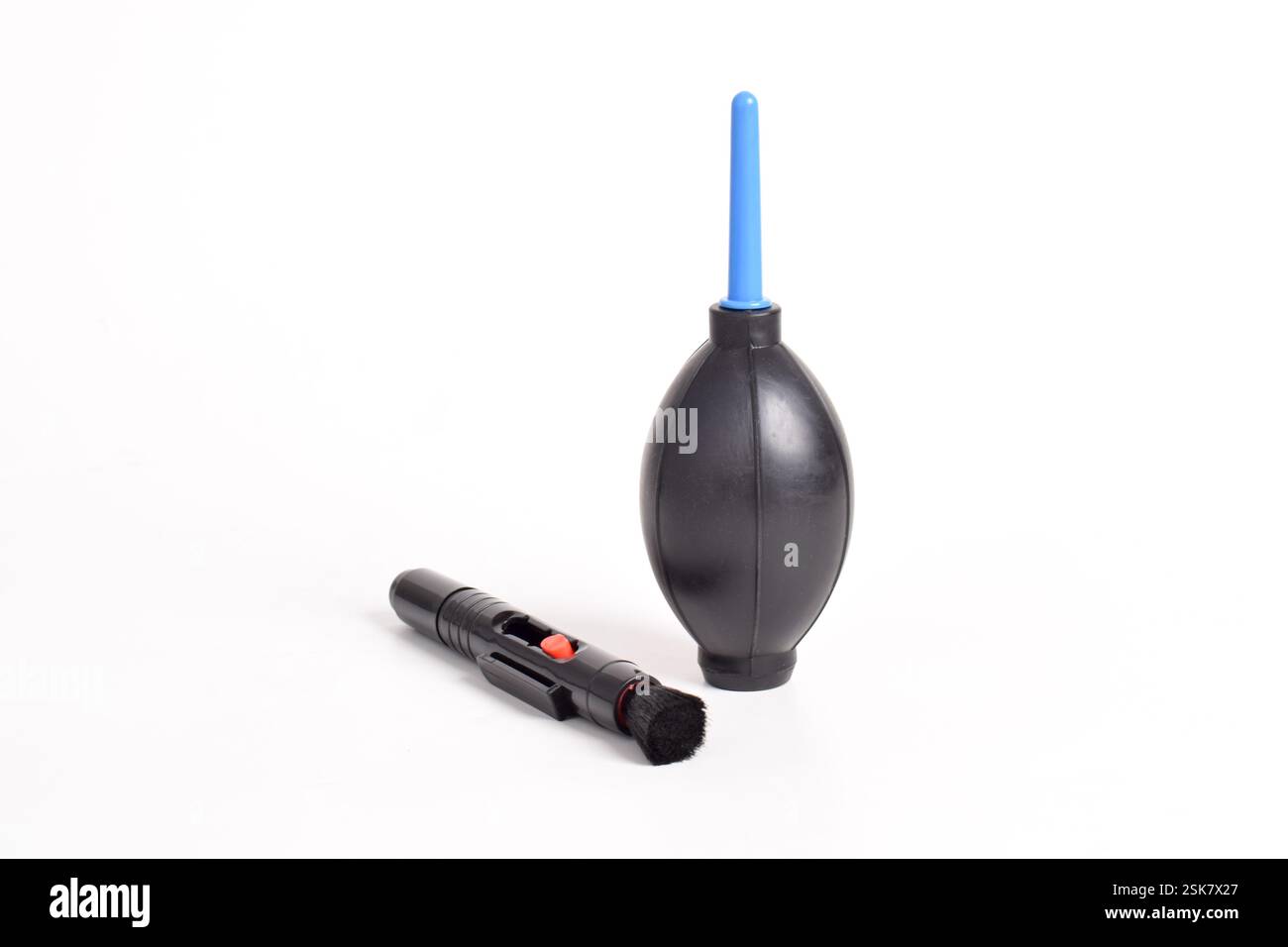 Cleaning set for camera. Air blower and brush isolated on white ...