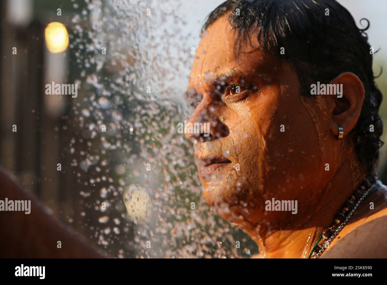 Kuala Lumpur, Malaysia. 11th Feb, 2025. A Hindu devotee seen wash their ...