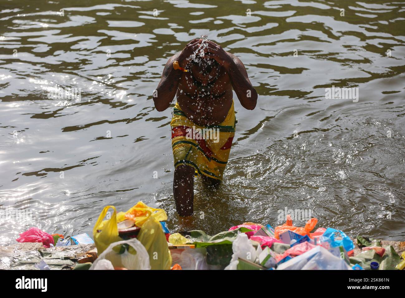 Kuala Lumpur, Malaysia. 11th Feb, 2025. A Hindu devotee seen wash their ...