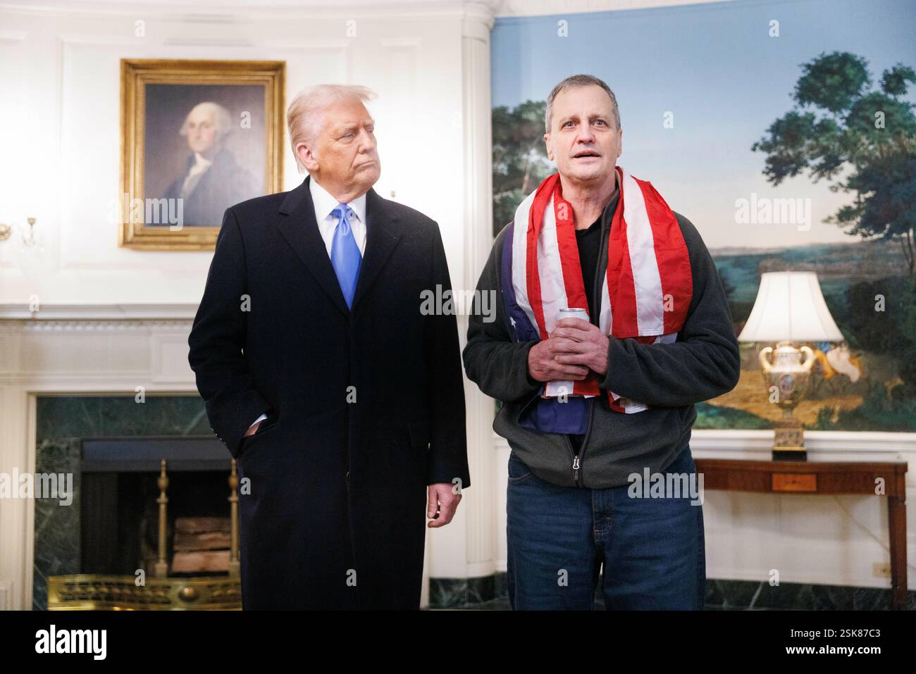 US President Donald Trump greets Mark Fogel, who was recently released ...