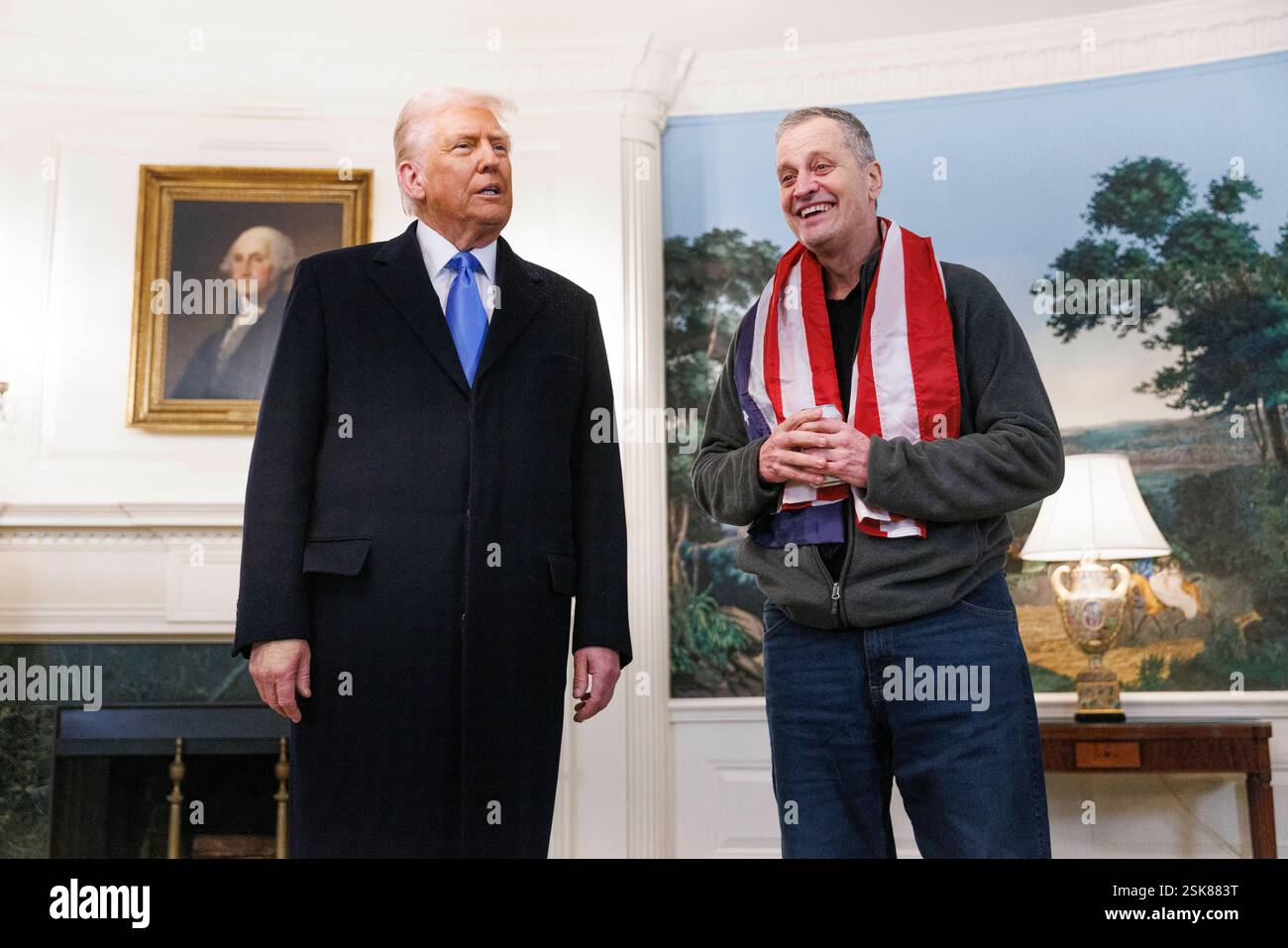 US President Donald Trump greets Mark Fogel, who was recently released ...