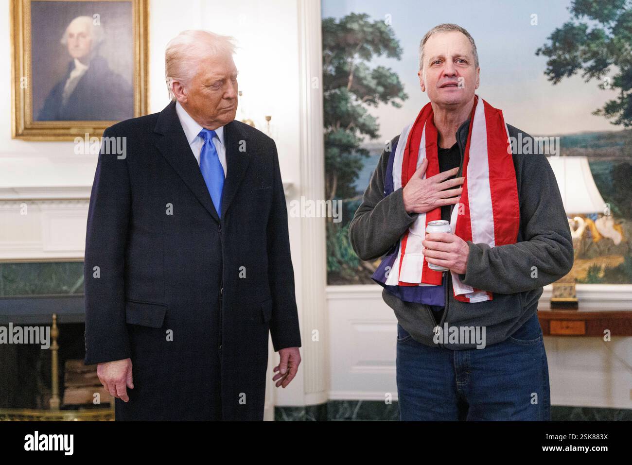 US President Donald Trump greets Mark Fogel, who was recently released ...