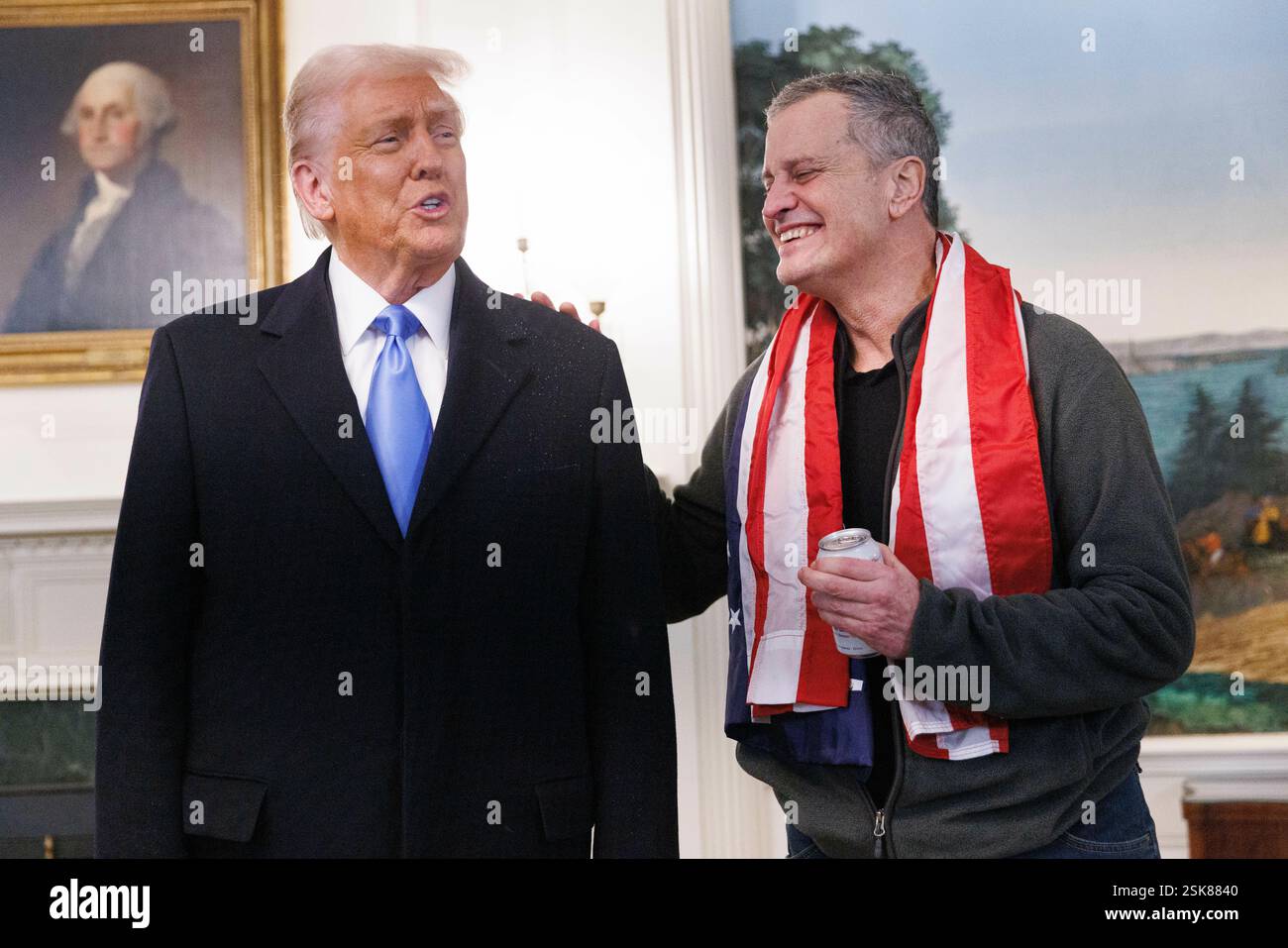 US President Donald Trump greets Mark Fogel, who was recently released ...