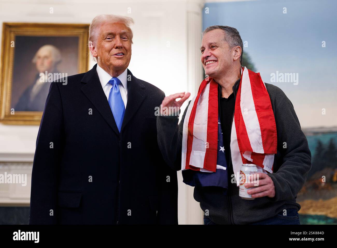US President Donald Trump greets Mark Fogel, who was recently released ...