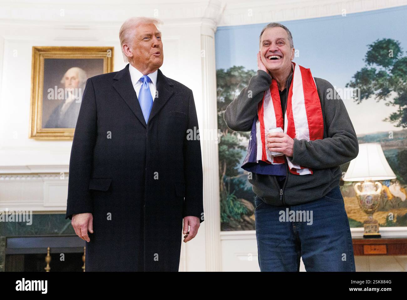 US President Donald Trump greets Mark Fogel, who was recently released ...