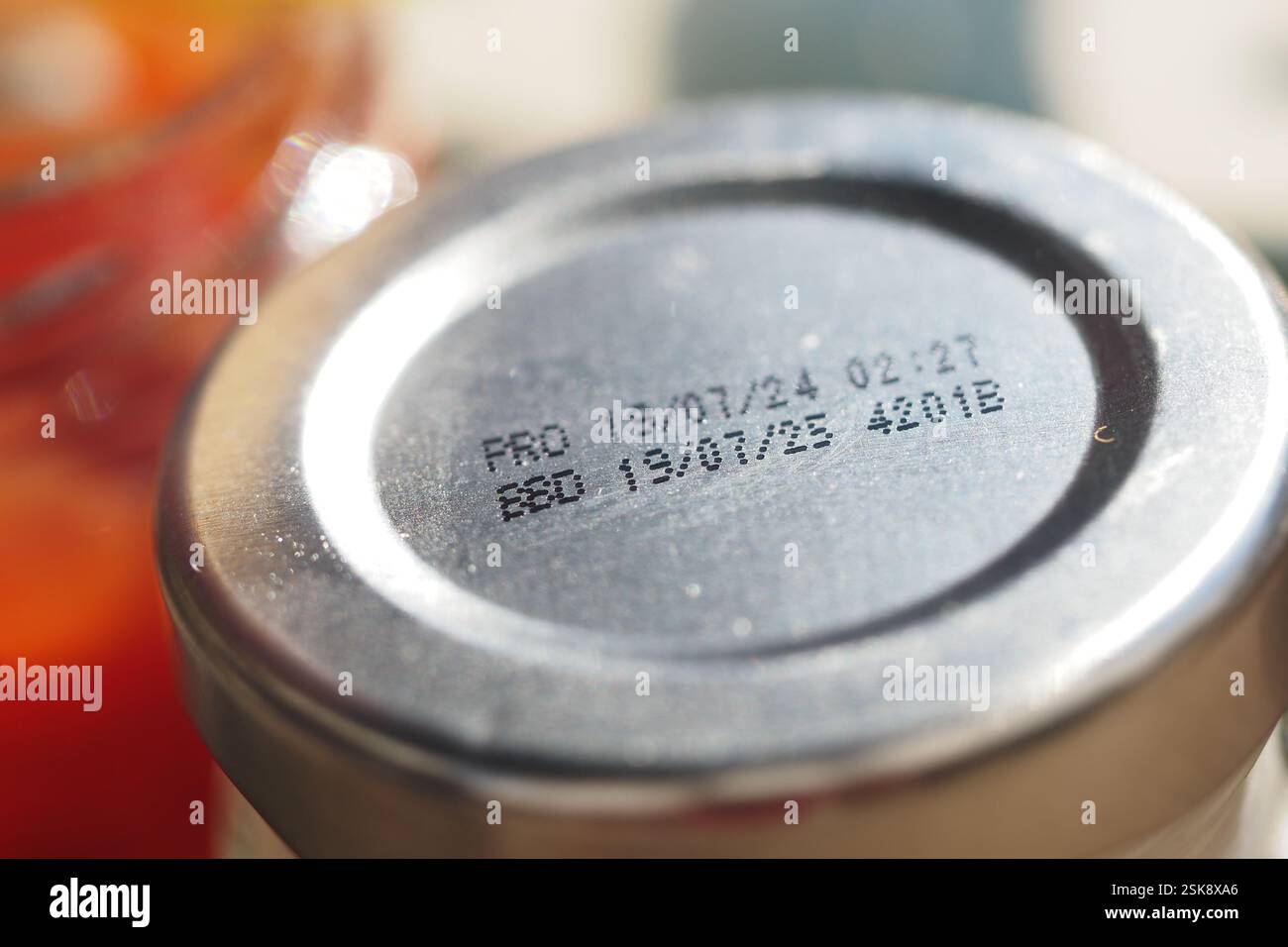 Date stamp on bottle cap showing preservation details Stock Photo - Alamy