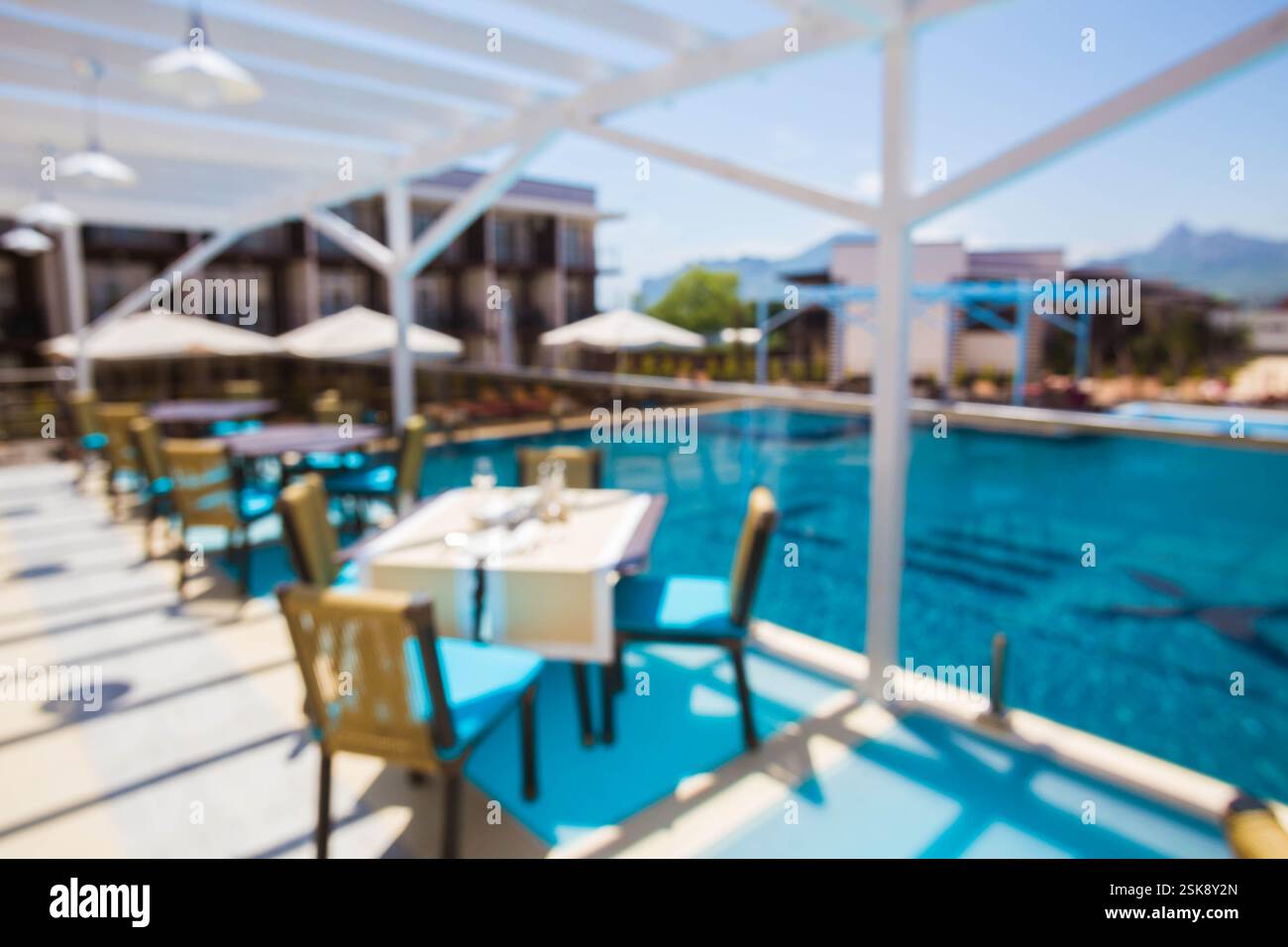 Poolside dining experience at a luxury resort during a sunny afternoon ...