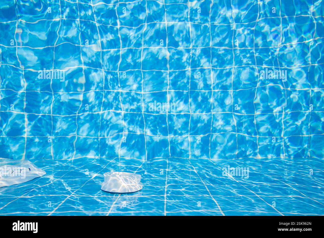 Refreshing blue swimming pool with rippling water and calm atmosphere ...