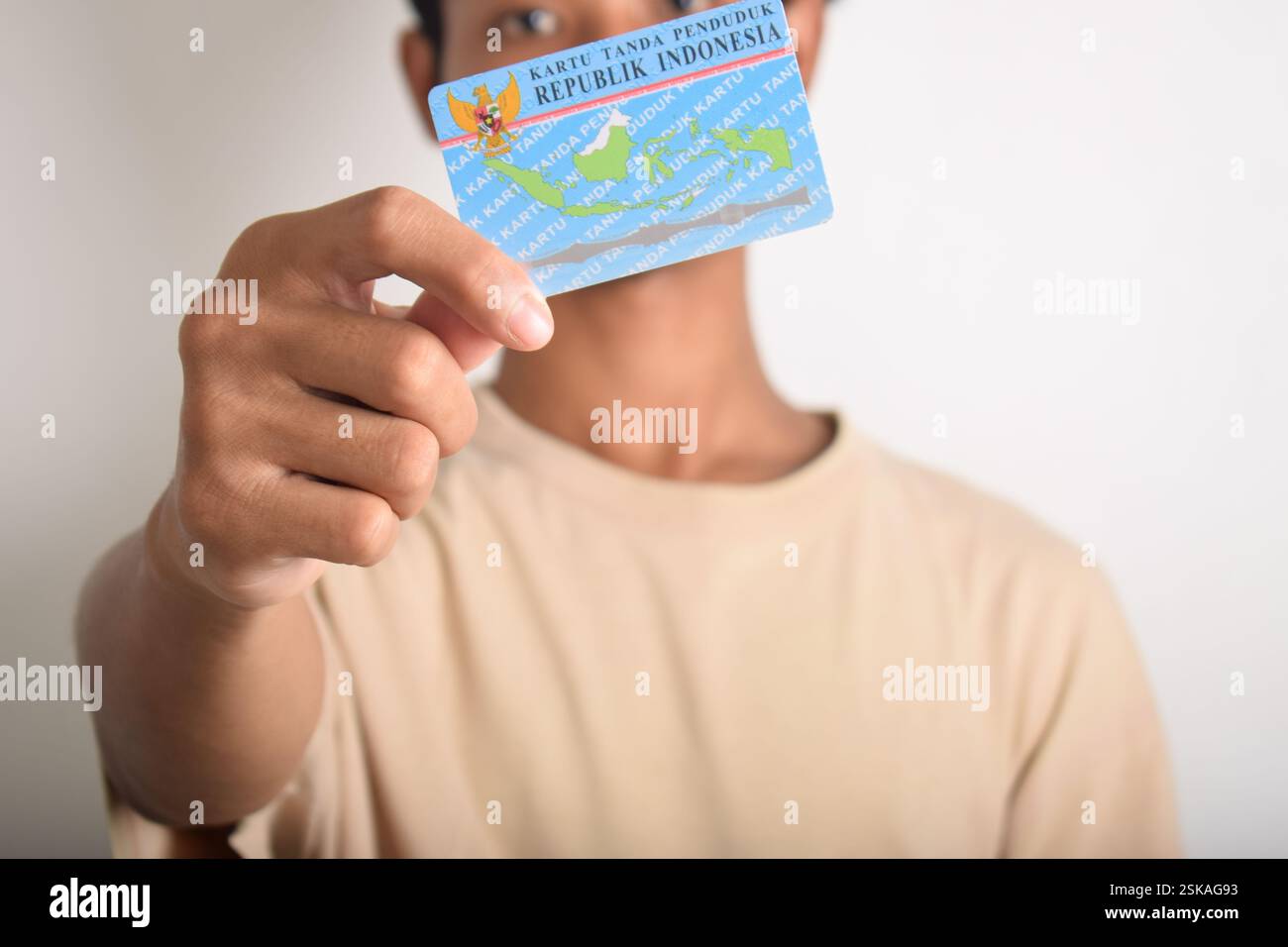 Pasuruan, Indonesia - February 9, 2025: Man holding KTP Kartu Tanda ...