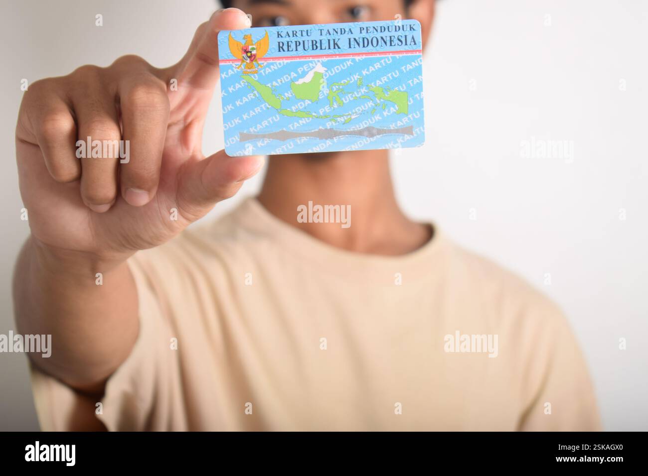 Pasuruan, Indonesia - February 9, 2025: Man holding KTP Kartu Tanda ...