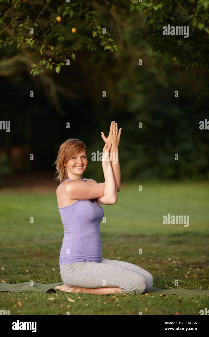 Yoga, smile and fitness with woman in nature for vatayanasana pose ...