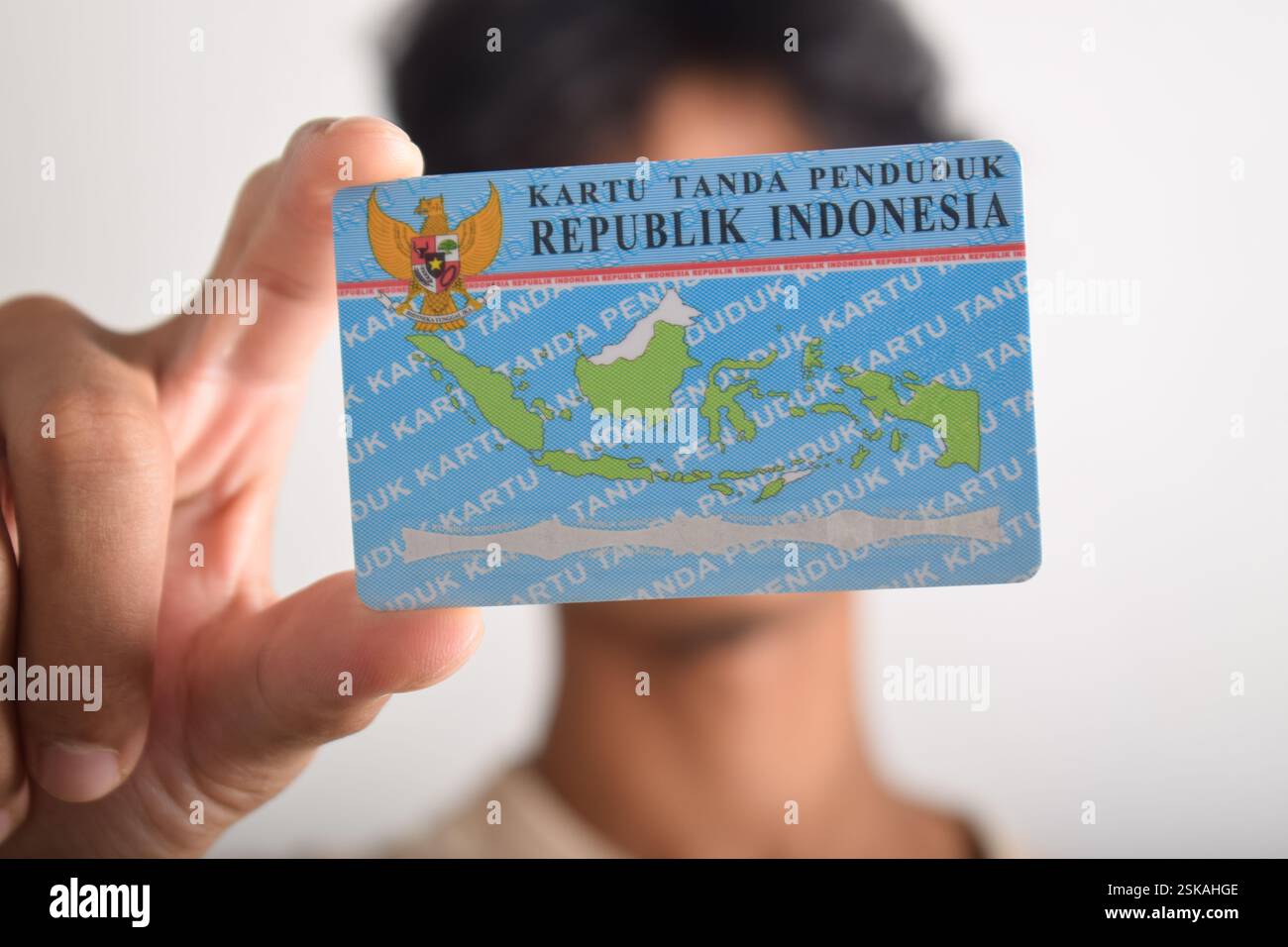 Pasuruan, Indonesia - February 9, 2025: Man holding KTP Kartu Tanda ...